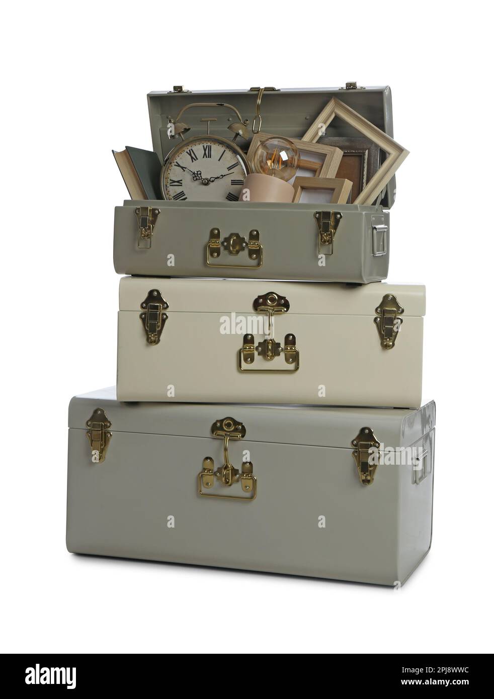 Stylish storage trunks with different interior elements on white ...