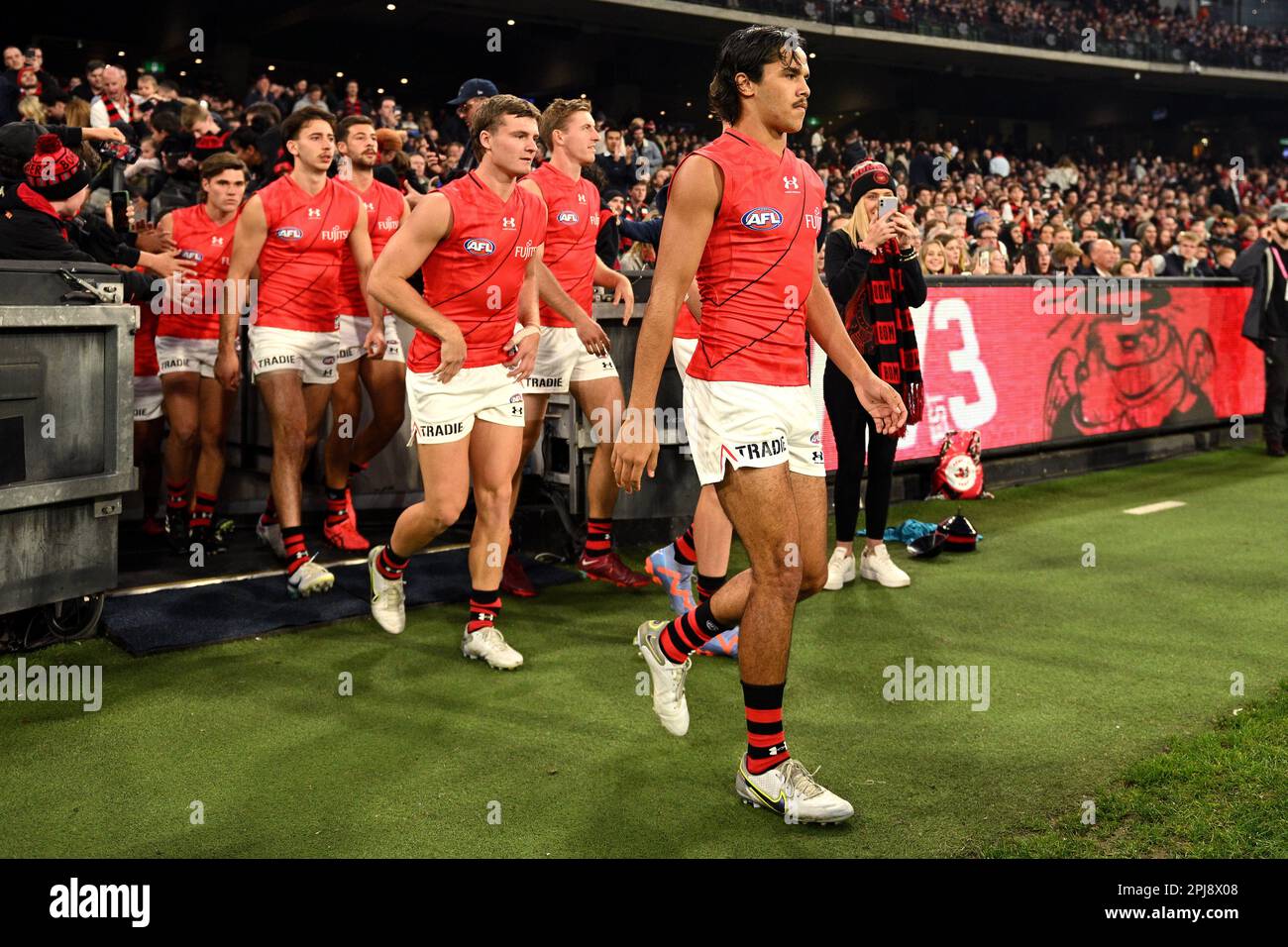 Essendon players take to the field during the AFL Round 3 match between ...