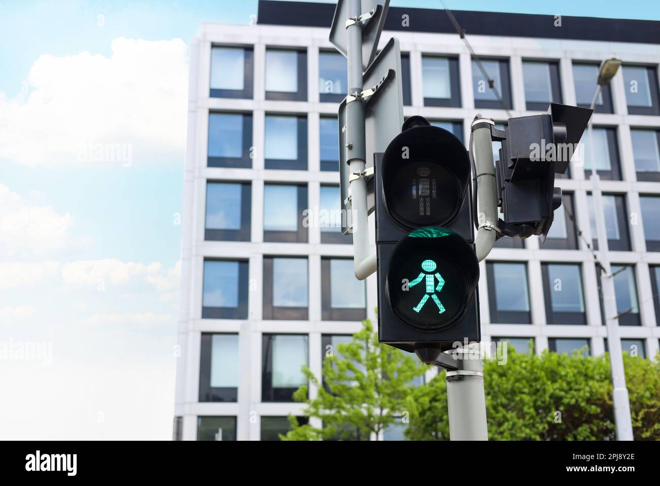Traffic light on city street, space for text Stock Photo - Alamy