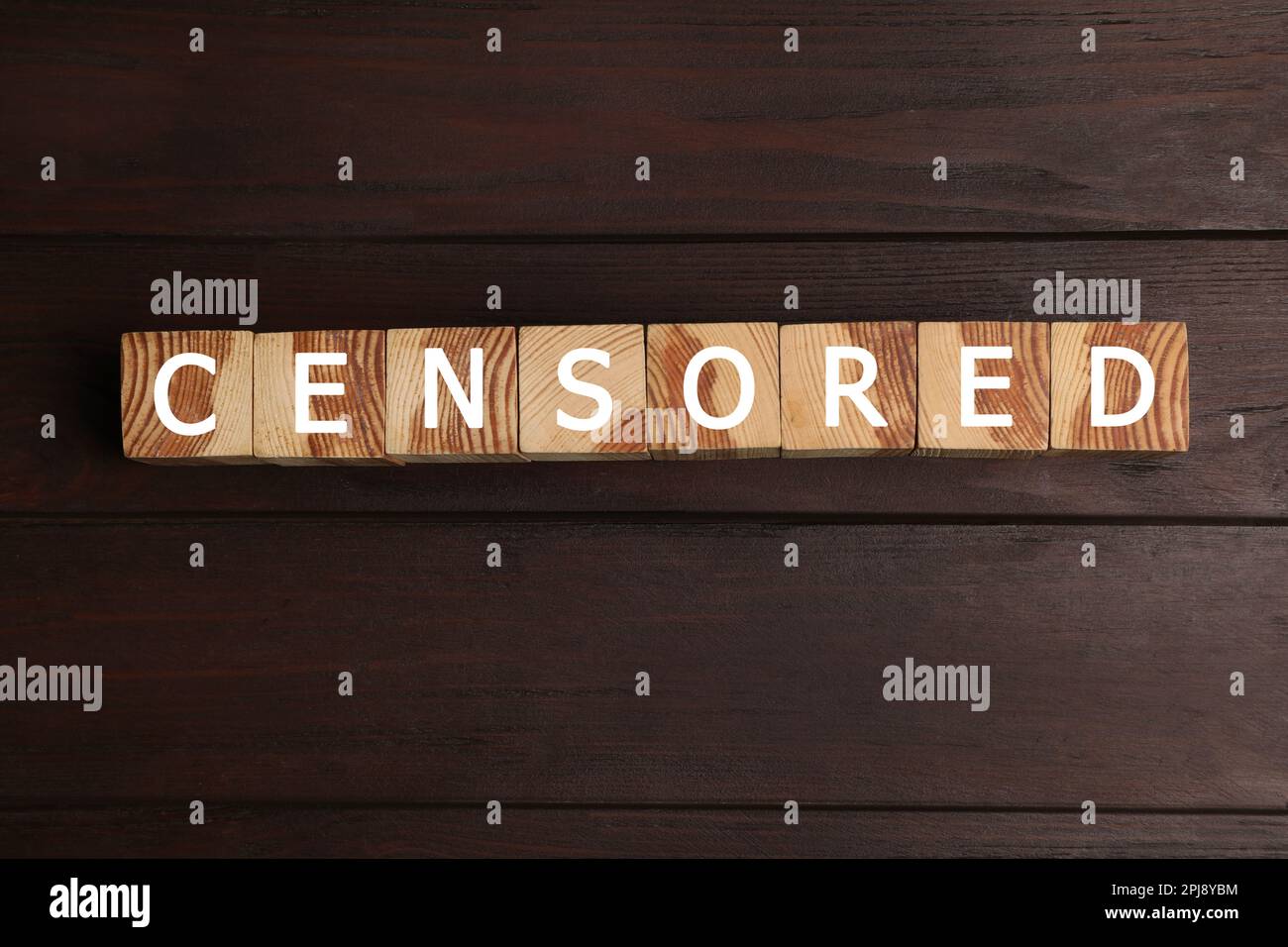 Cubes with word Censored on wooden table, flat lay Stock Photo - Alamy