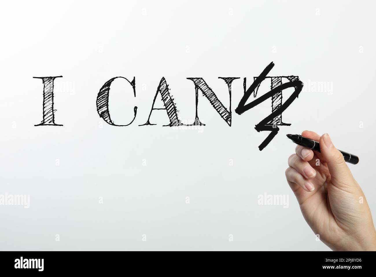 Woman crossed out letter T in phrase I CAN'T on white background ...
