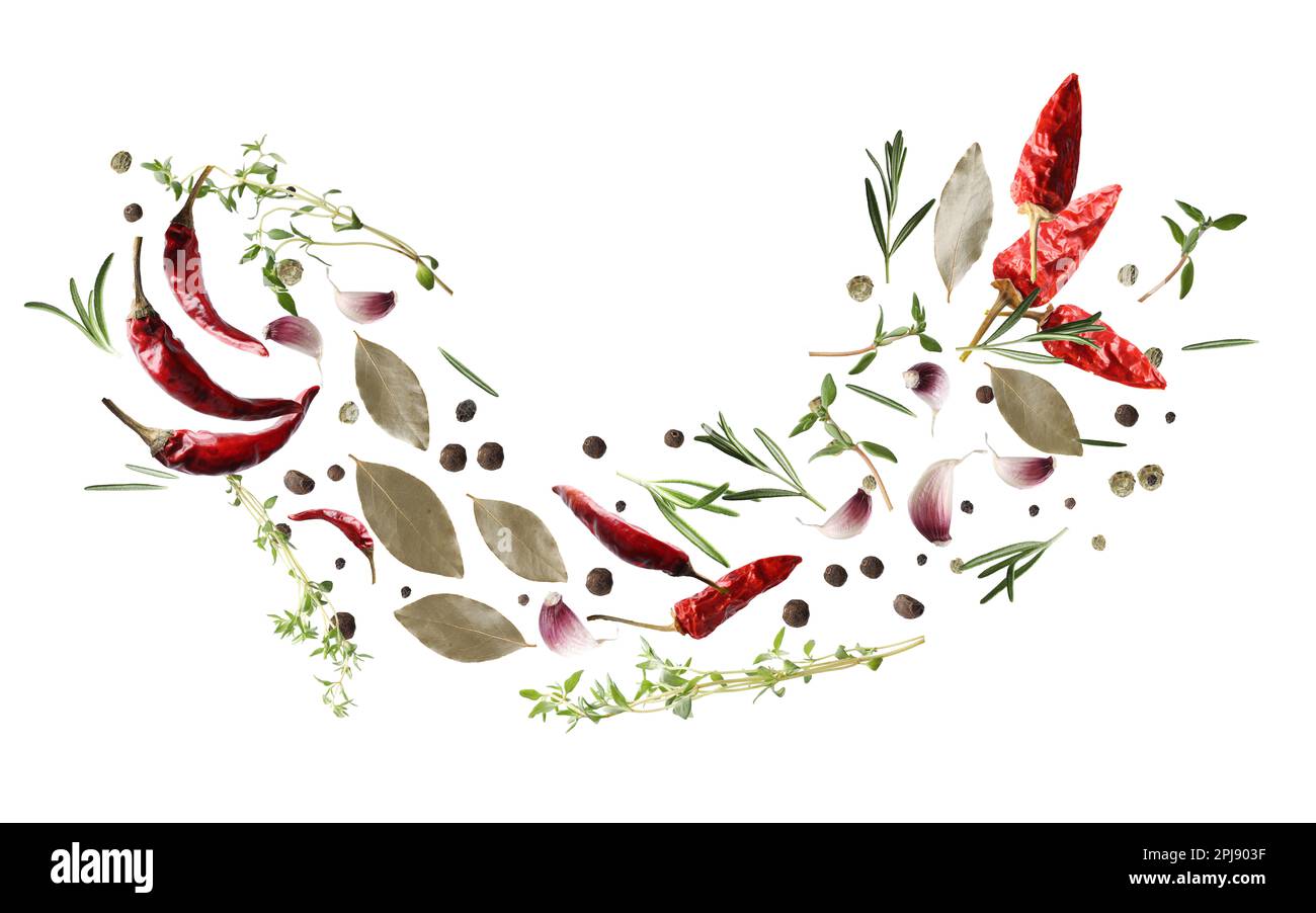 Many different spices flying on white background Stock Photo - Alamy