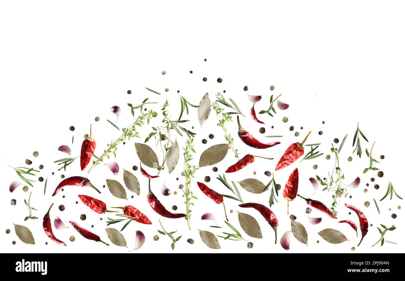 Many different spices flying on white background Stock Photo - Alamy