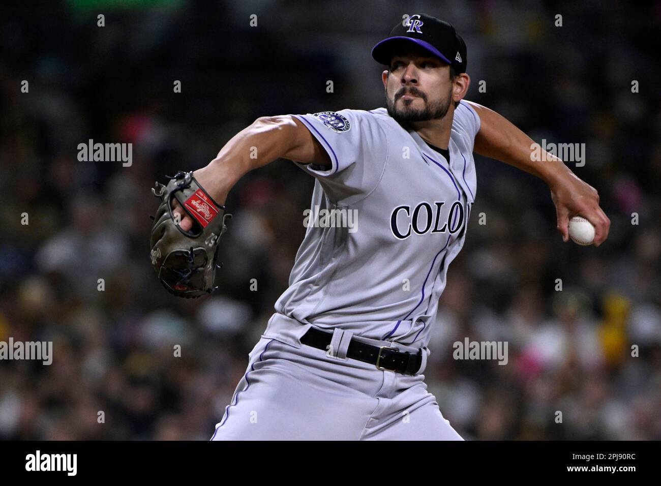 Colorado Rockies relief pitcher Brad Hand throws to a San Diego Padres ...