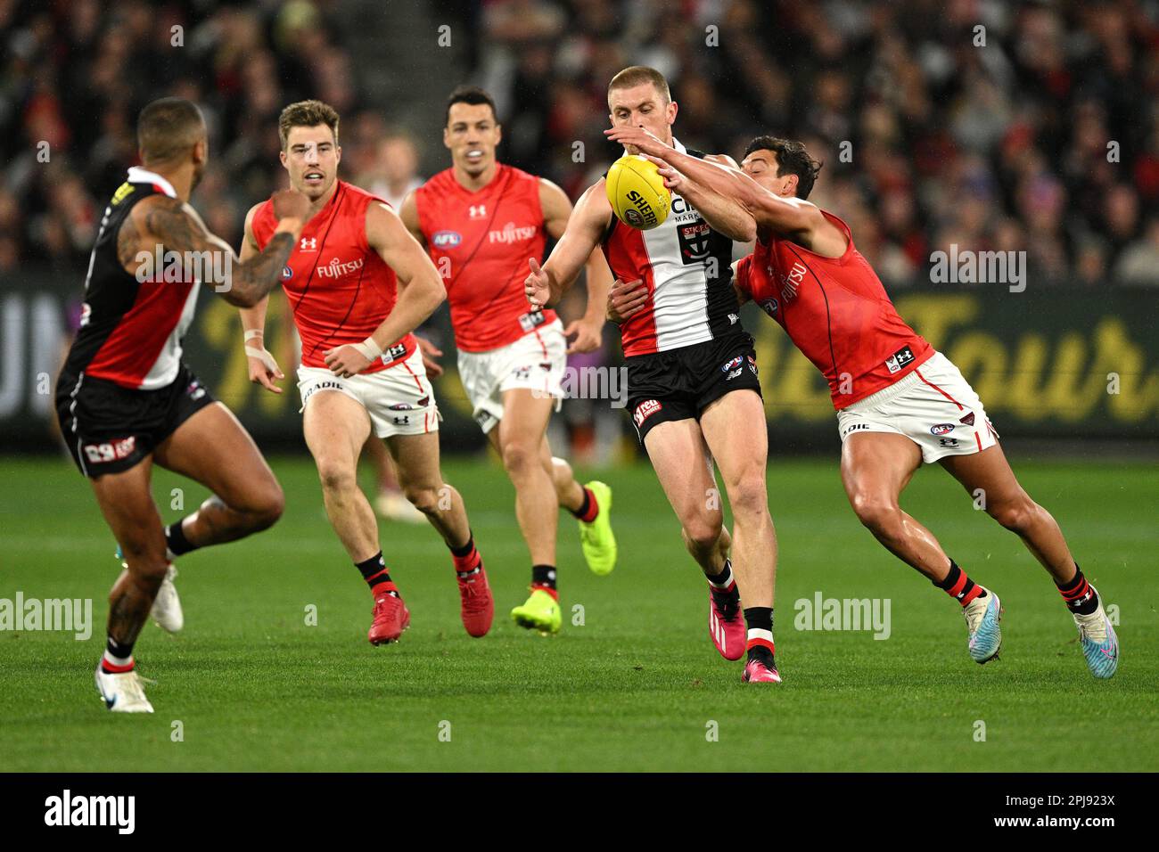 Sebastian Ross of the Saints reaches for the ball during the AFL Round ...