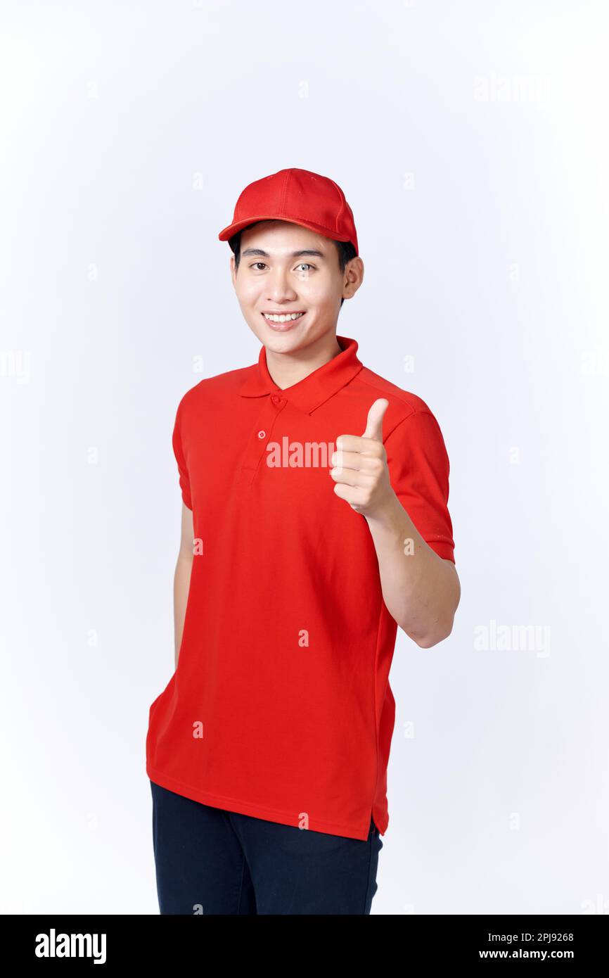 Professional delivery guy employee man in red cap T-shirt uniform ...