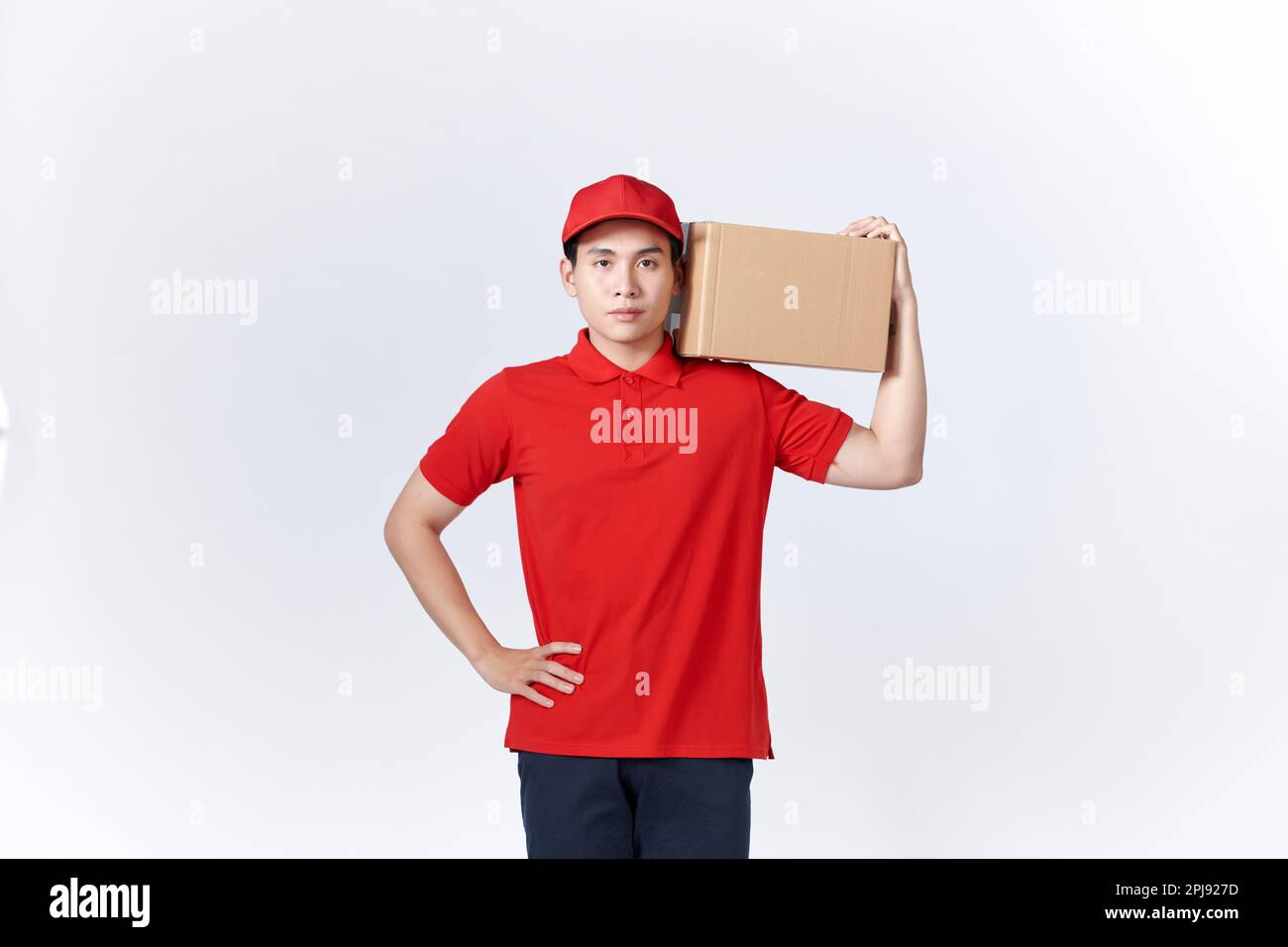 Attractive package delivery man hi-res stock photography and images - Alamy