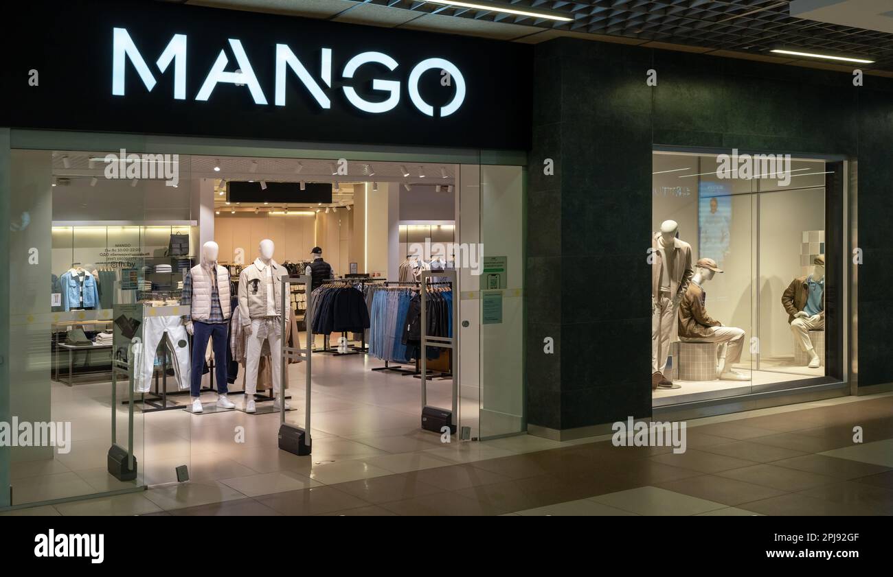 MANGO clothing store in shopping center. Logo and view inside the store ...