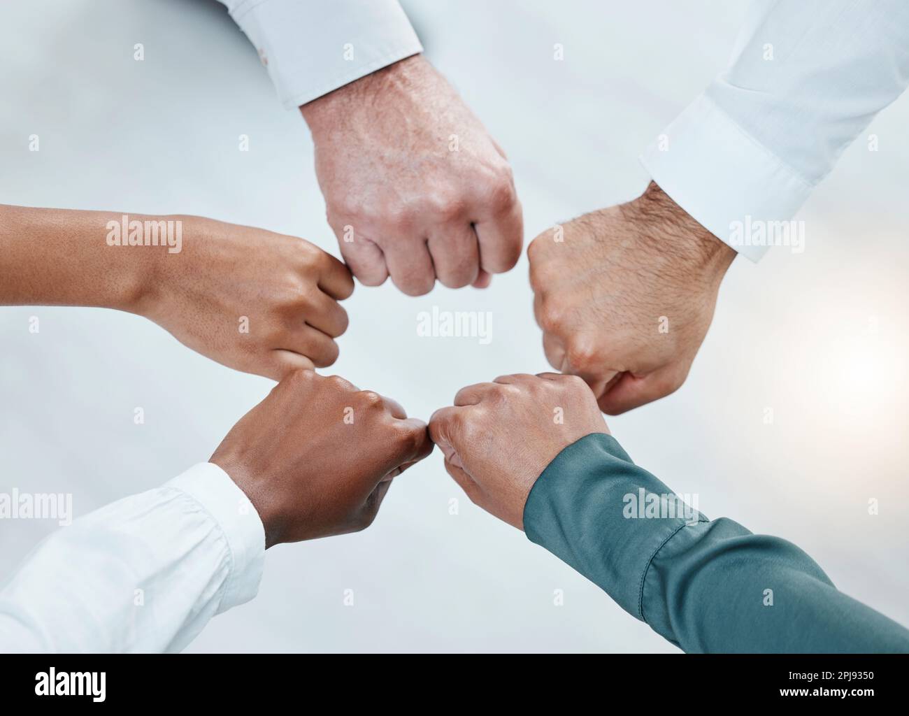 Teamwork, fist bump and hands of business people together for motivation, support and community ...