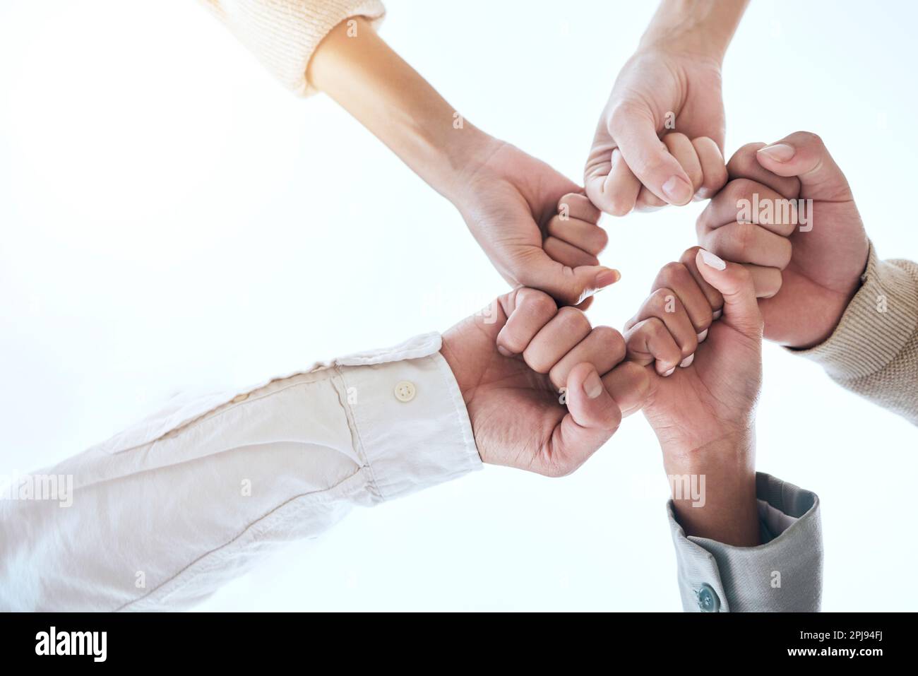 Below business people, fist bump and circle for team building, support ...