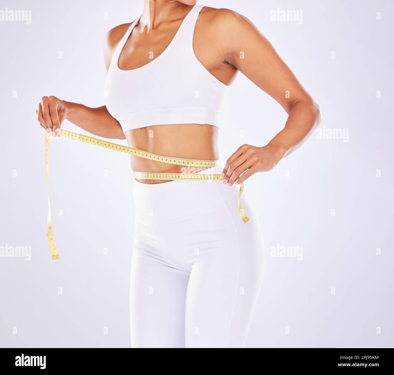 Health, waist and tape measure for diet of woman in studio for healthy ...