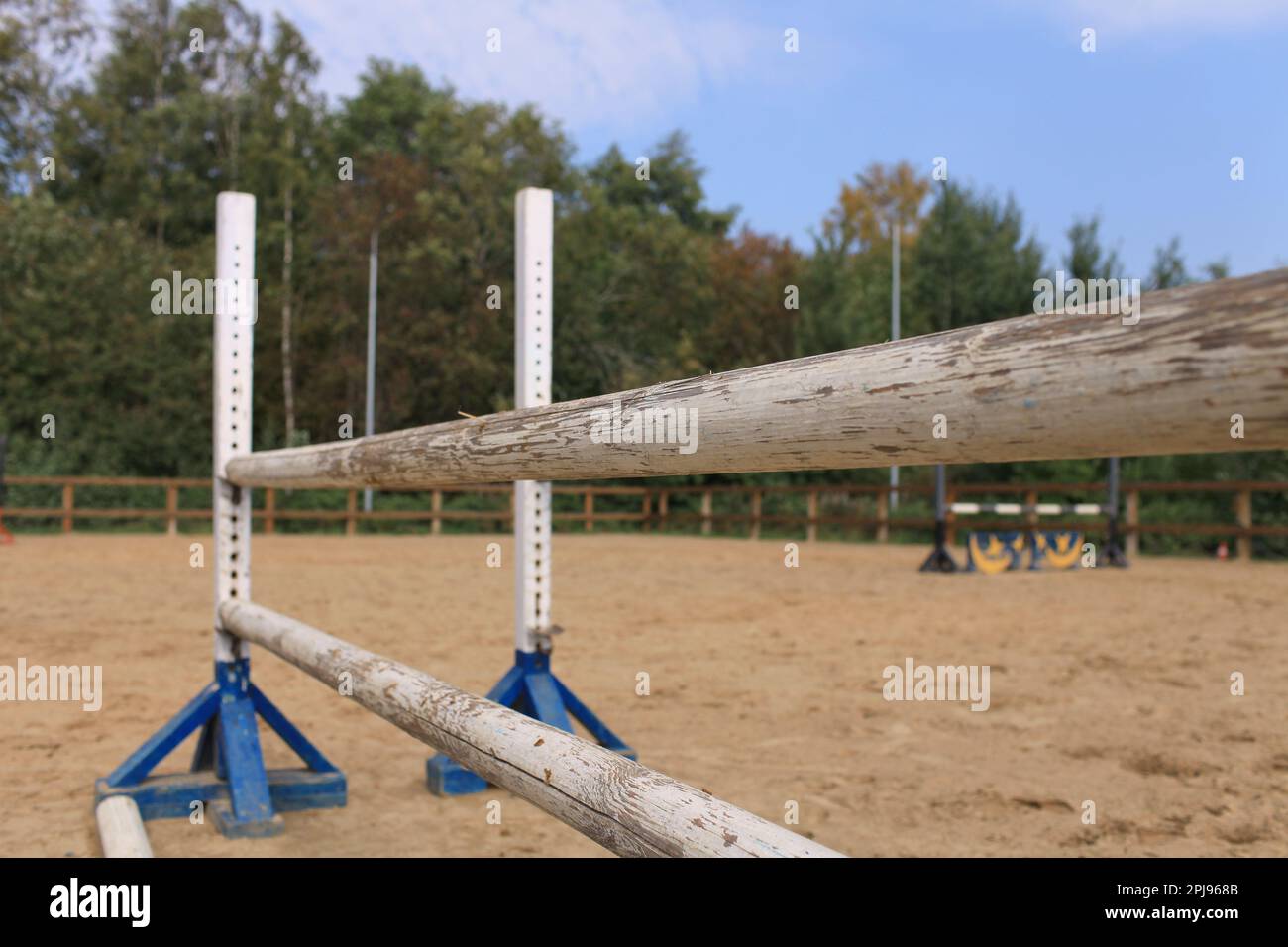 jumping hurdle with two poles for schooling horses on the empty ...