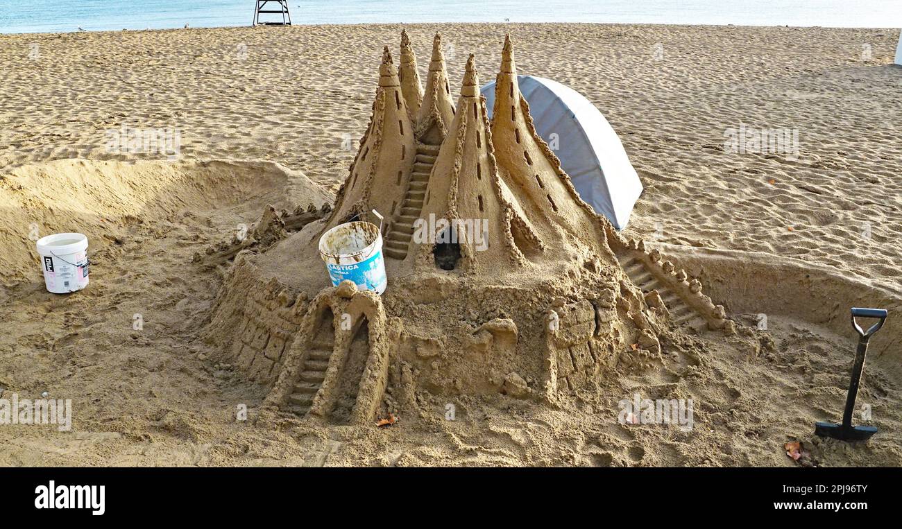 Sand castle on the beach of Peñiscola with castle in the background ...