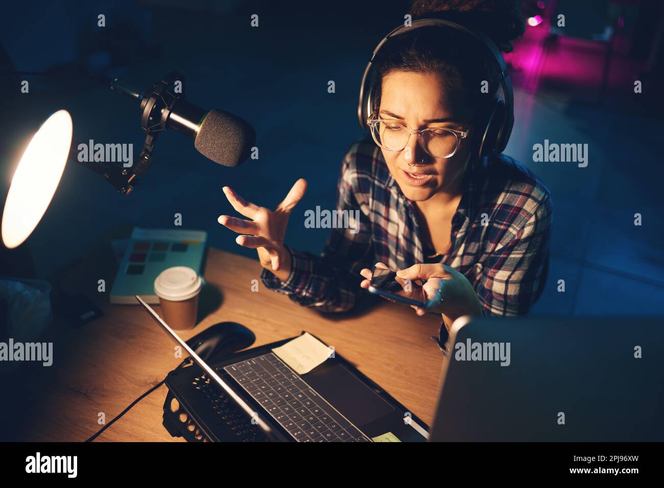 Podcast, live streaming and woman on microphone speaking, advice or ...