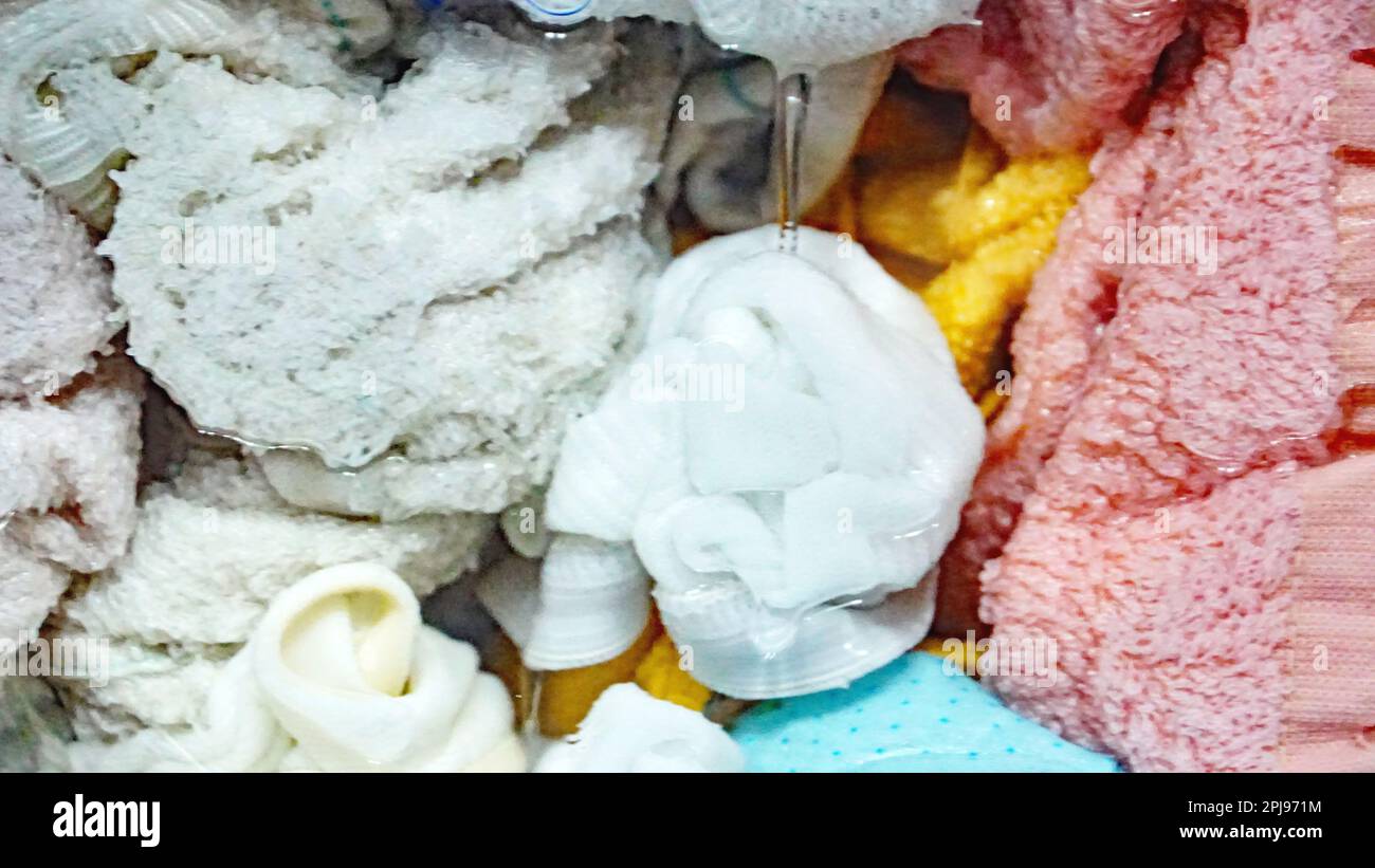 Clothes being washed in a washing machine Stock Photo - Alamy