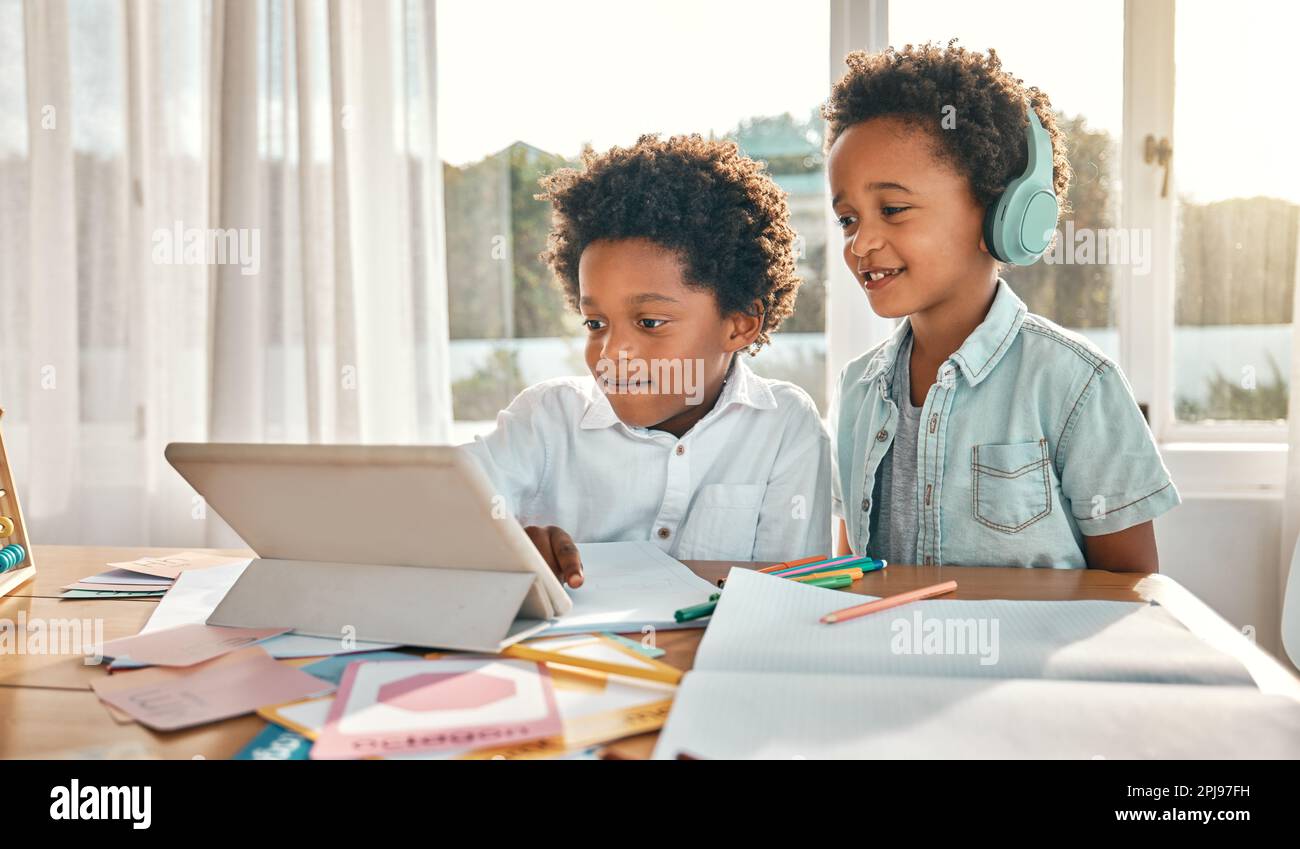 Tablet, headphones and children doing a elearning class together in the ...