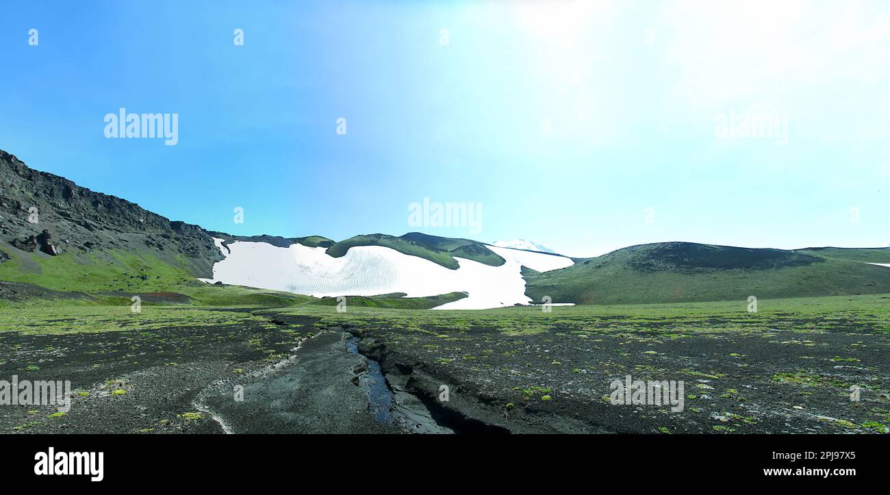 Glaciology. Permanent snow patch (pereletok) on a leeward slope and ...