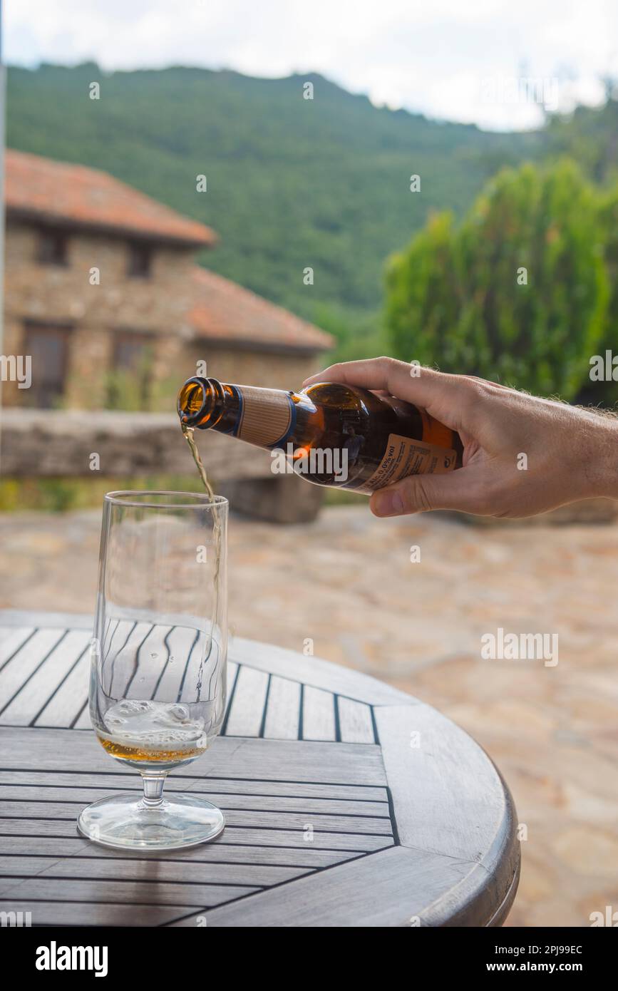 Bottle pouring beer in a glass Stock Photo - Alamy