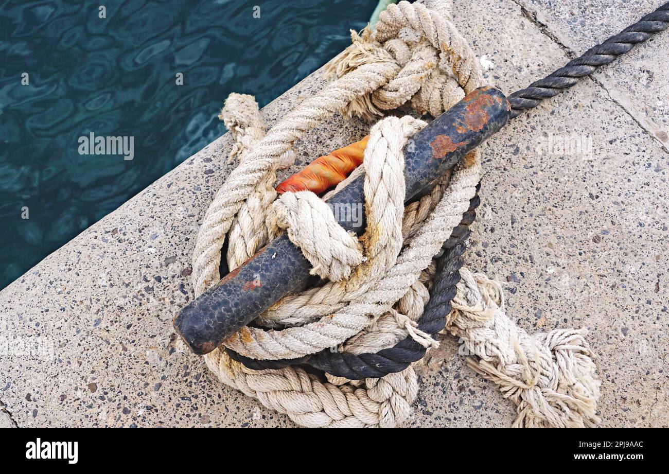 Bollard with mooring ropes in the port of La Restinga, El Hierro ...