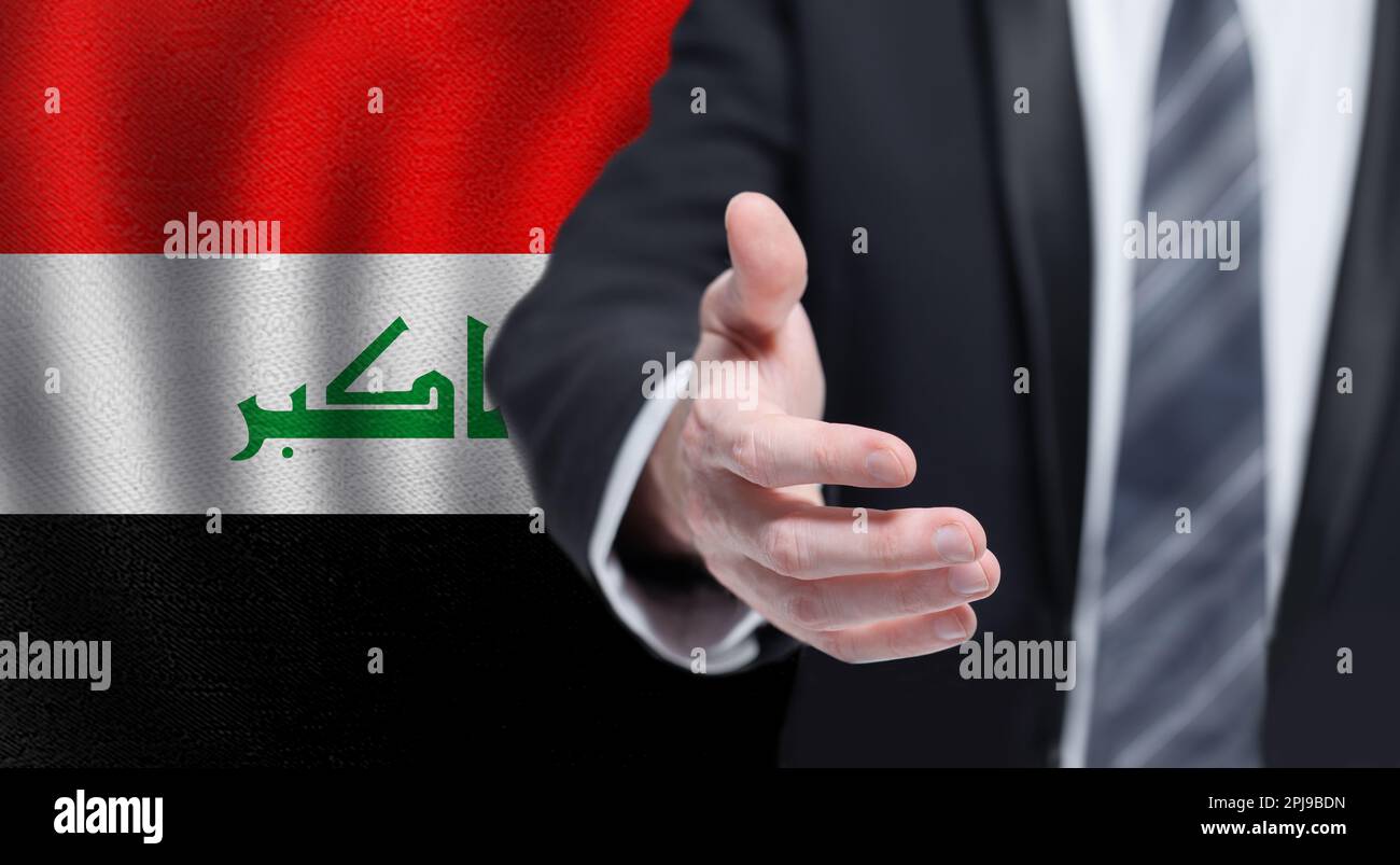 Iraqi business, politics, cooperation and travel concept. Hand on flag ...
