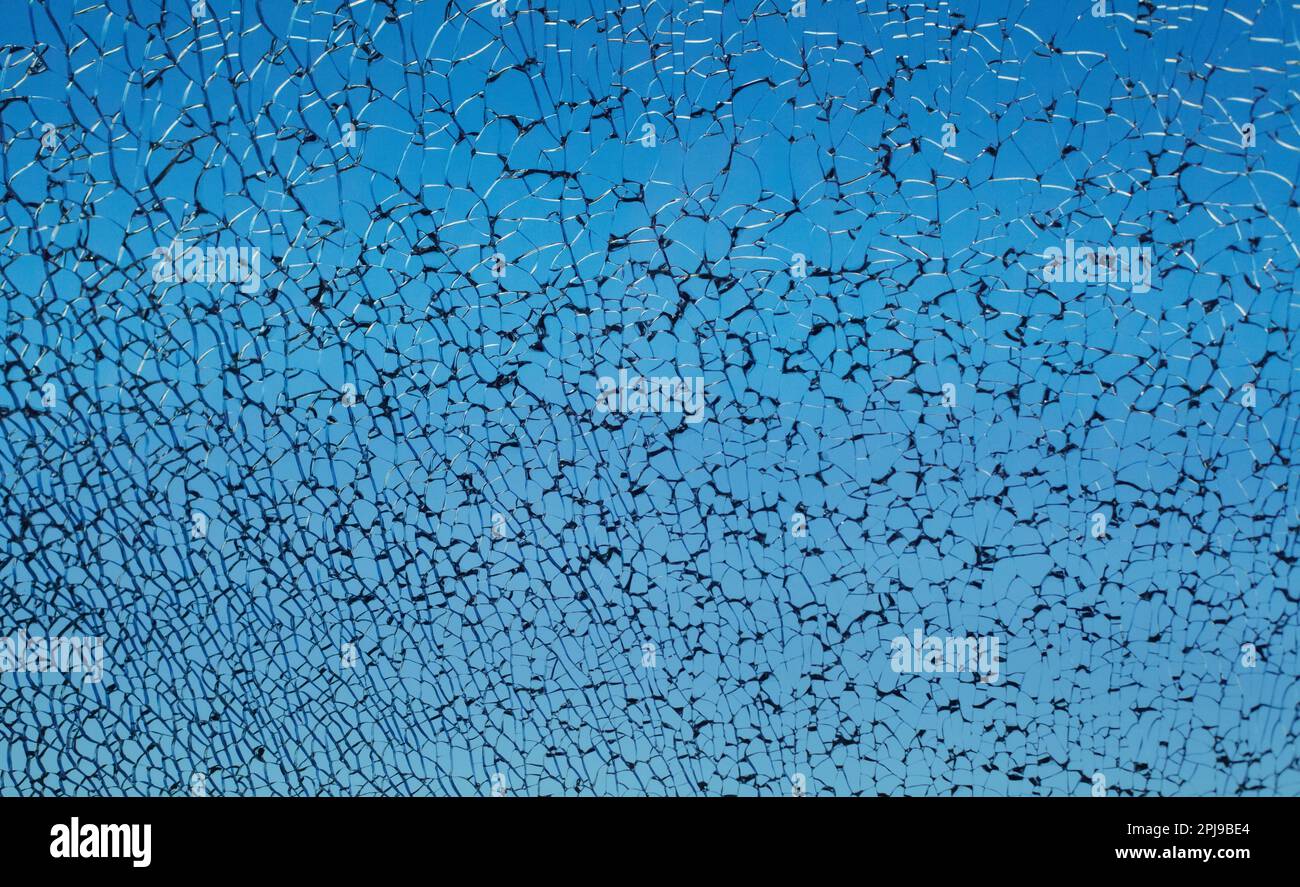 Blue broken cracked shattered window glass with black cracks Stock ...