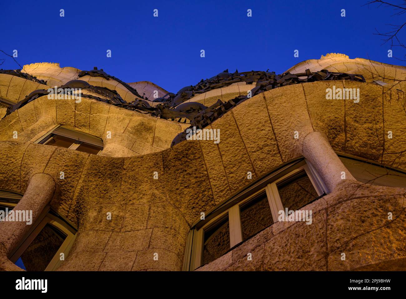 Facade of La Pedrera (Casa Milà) at twilight and night, a work of ...