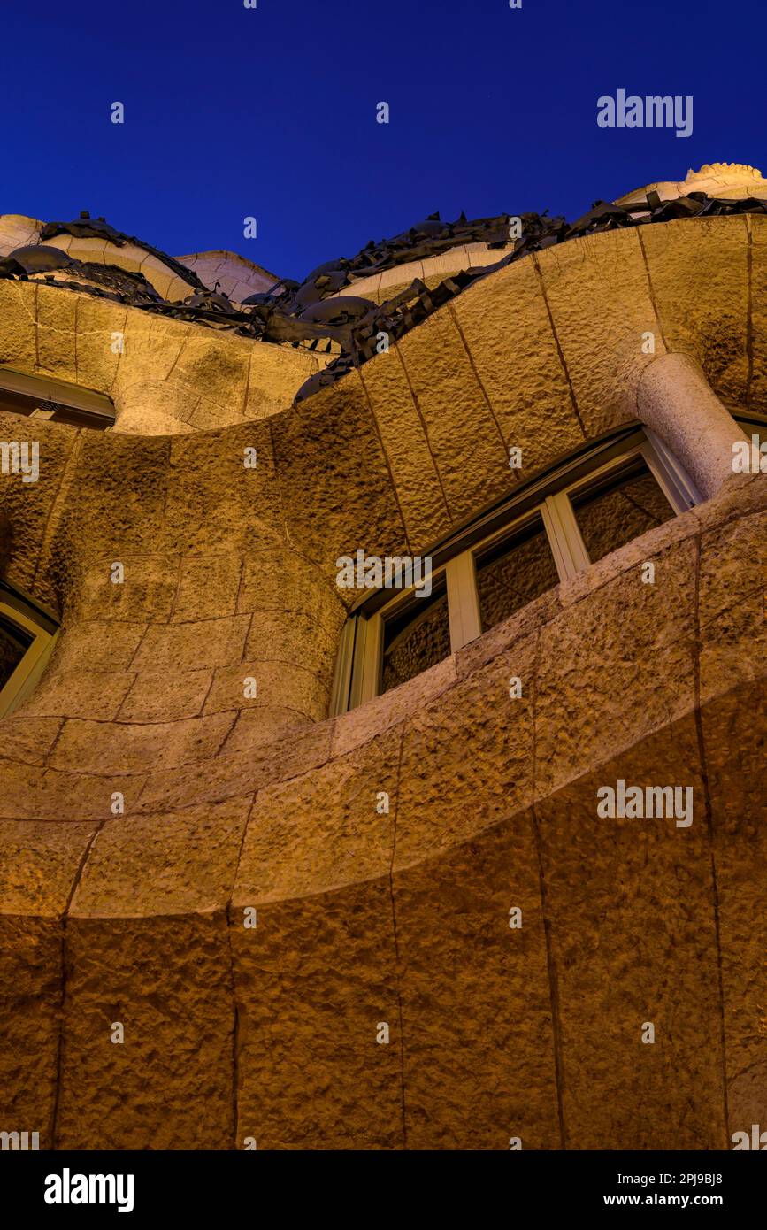 Facade of La Pedrera (Casa Milà) at twilight and night, a work of ...