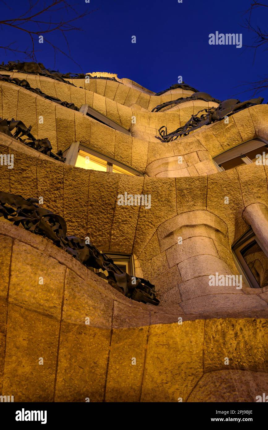 Facade of La Pedrera (Casa Milà) at twilight and night, a work of ...