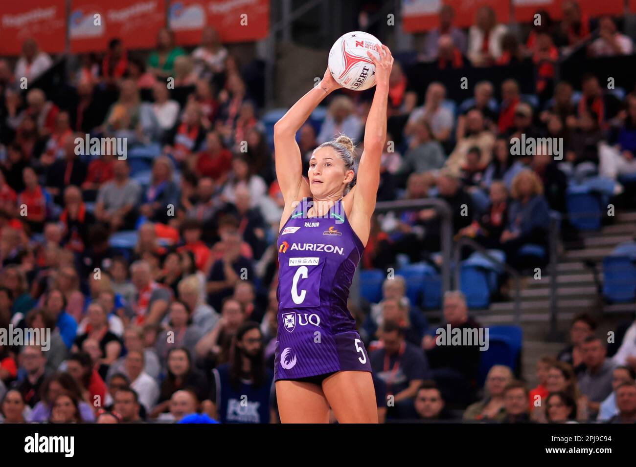 Kim Ravaillion of the Firebirds look to pass during the Super Netball ...