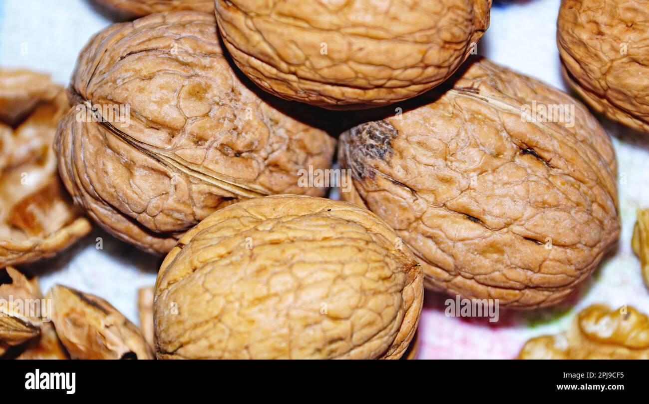 Walnuts and nutcracker on white background Stock Photo - Alamy