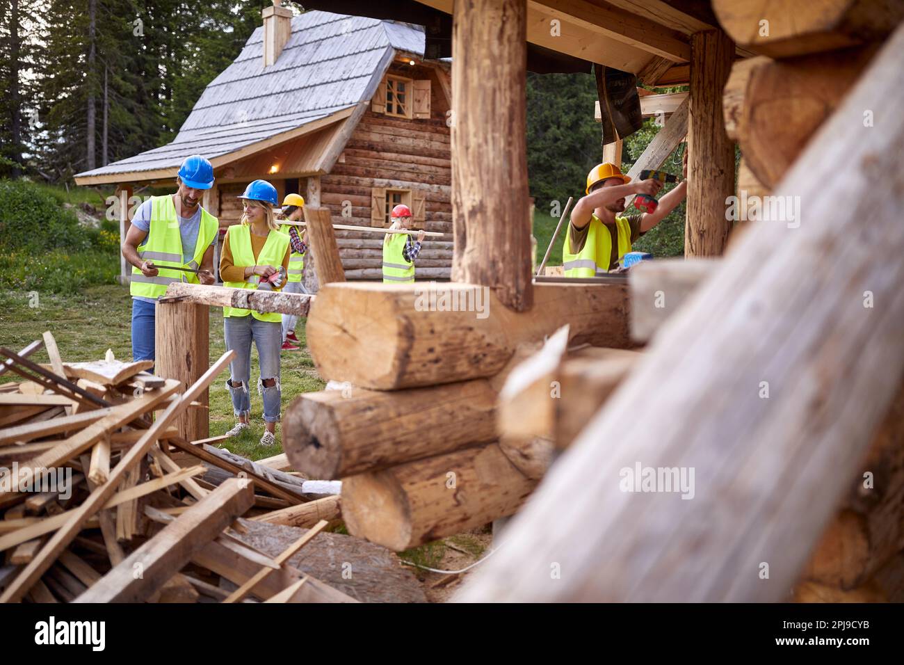 Young construction workers team building together; Renovation concept ...