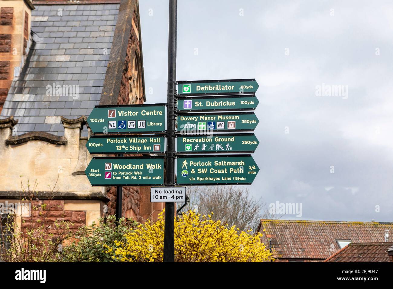 Tourist direction signs in Porlock, Somerset Stock Photo - Alamy