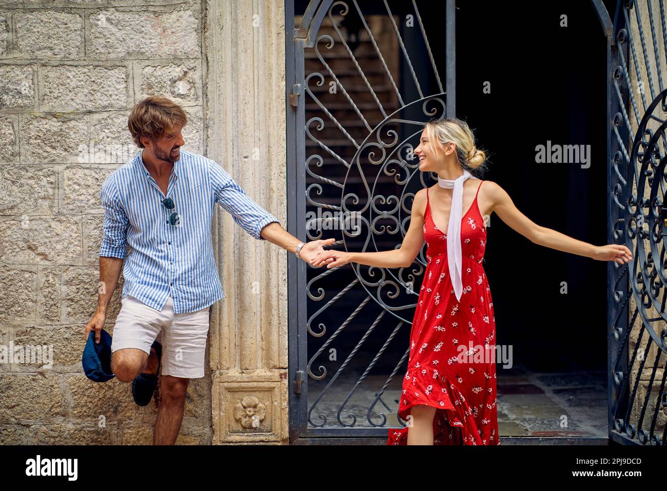 Romantic couple on a walk trough an old town together Stock Photo - Alamy