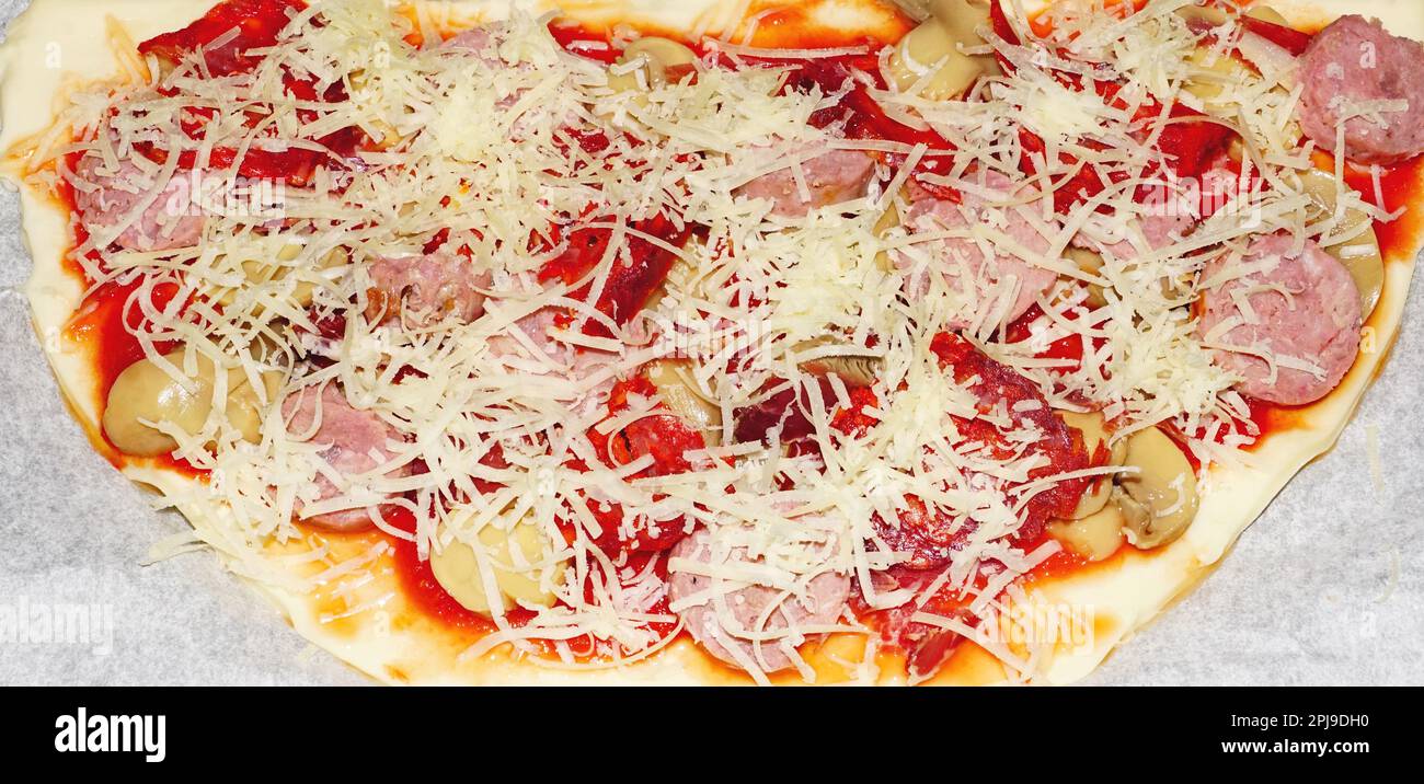 Pizza before entering the oven Stock Photo - Alamy