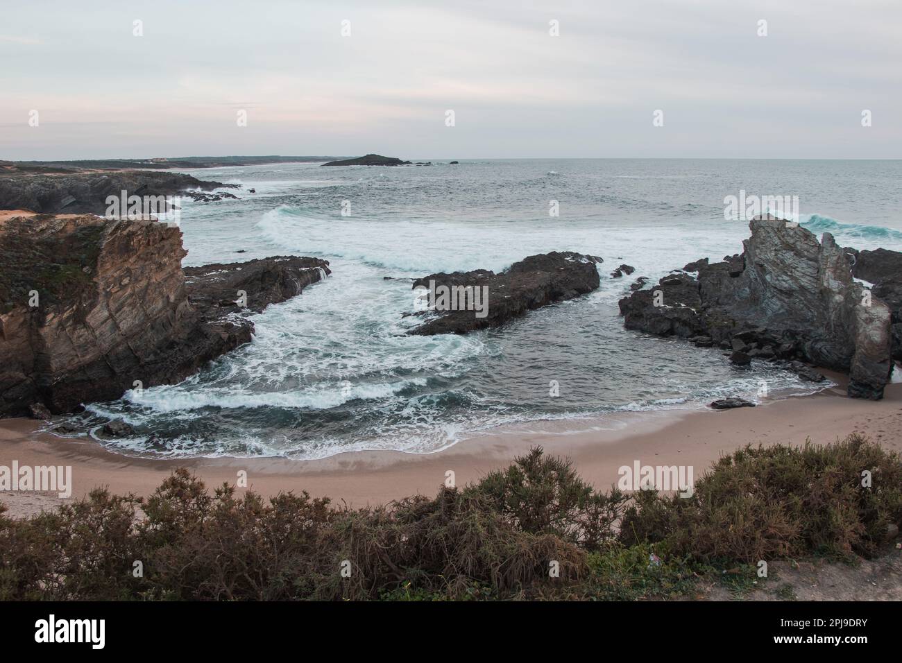 Beauty of the sandy beach of Praia dos Buizinhos with the cliffs at ...