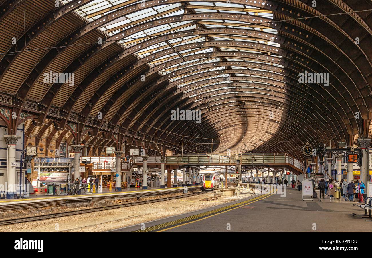 Panoramic view of a railway station with an historic ornate iron canopy ...