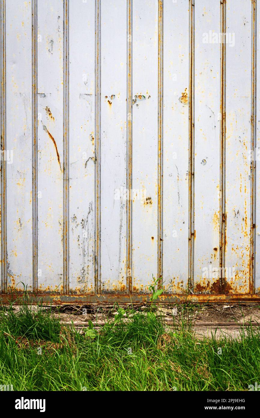 Old white metal warehouse wall. Architecture detail background. Metal ...