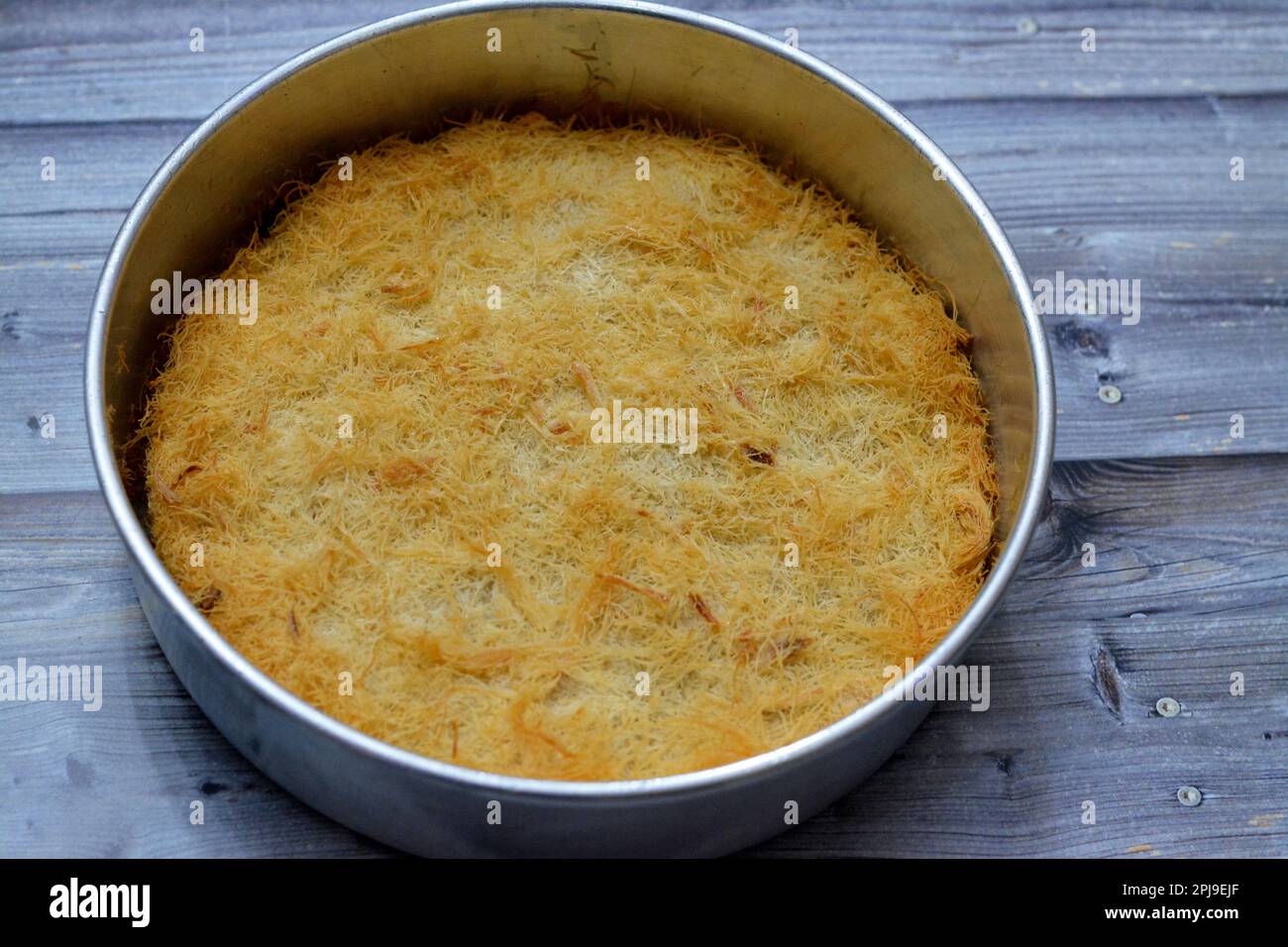 A traditional middle eastern dessert Knafeh Konafa made with spun ...