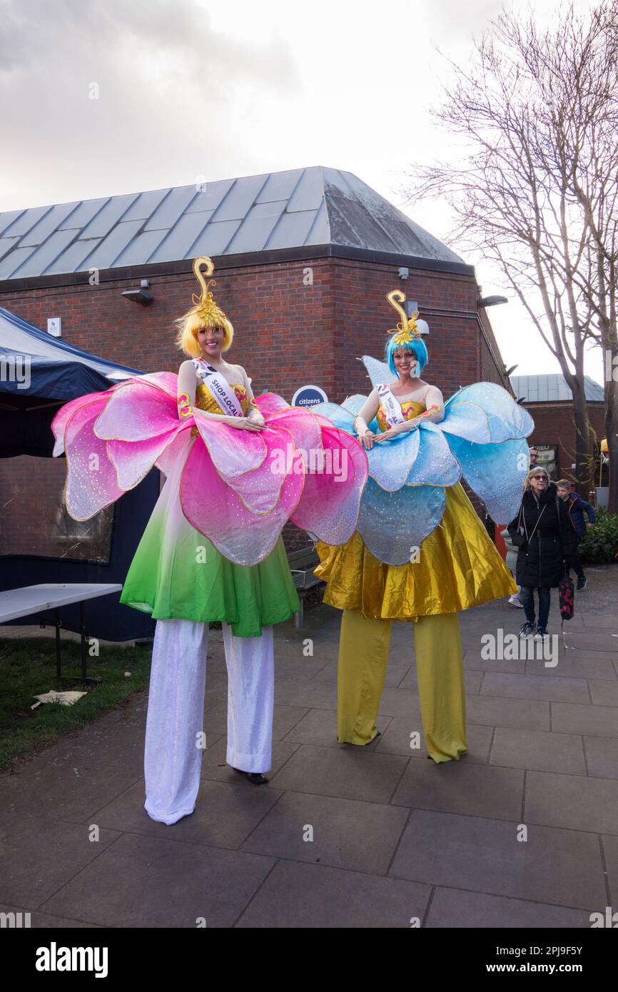 Two colourful young women on stilts at Sheen Library, Sheen, London ...
