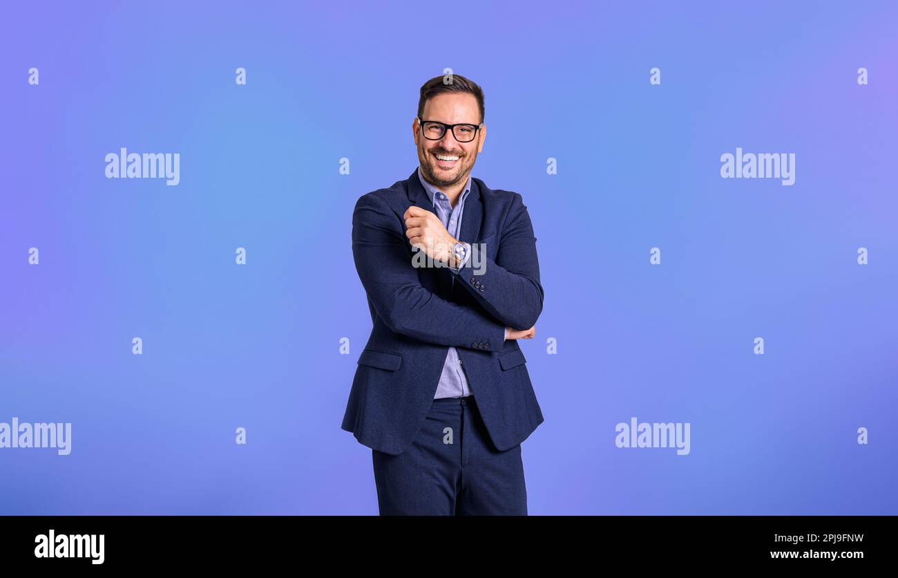 Portrait of confident young adult handsome CEO dressed in blue suit ... Portrait of confident young adult handsome CEO dressed in blue suit ...