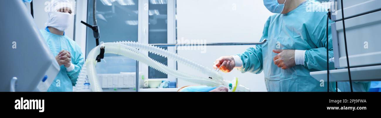 Doctor performing operation in surgery room, closeup. Banner design ...