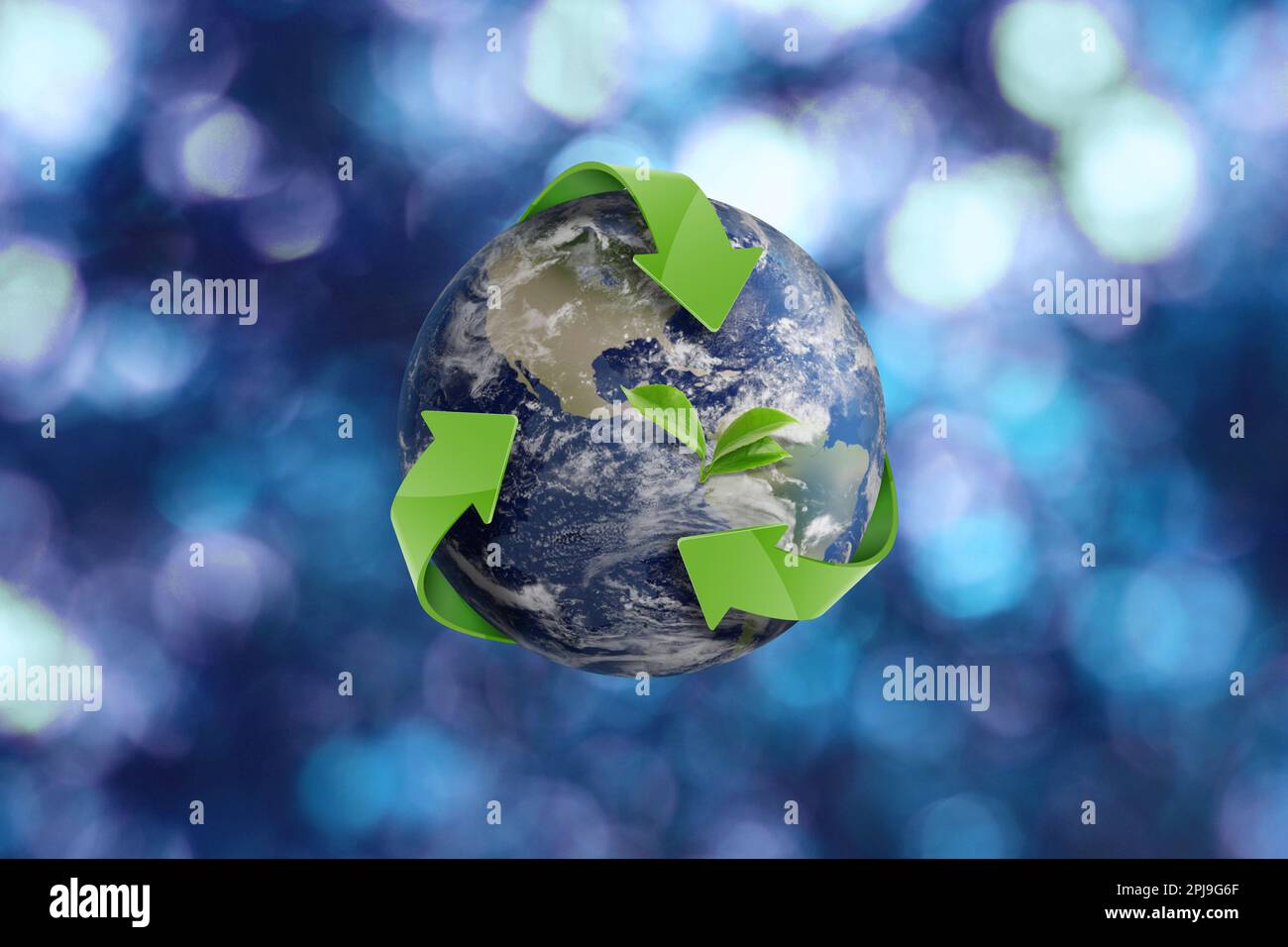 Recycling concept. Earth planet with green arrows and leaves on blurred ...