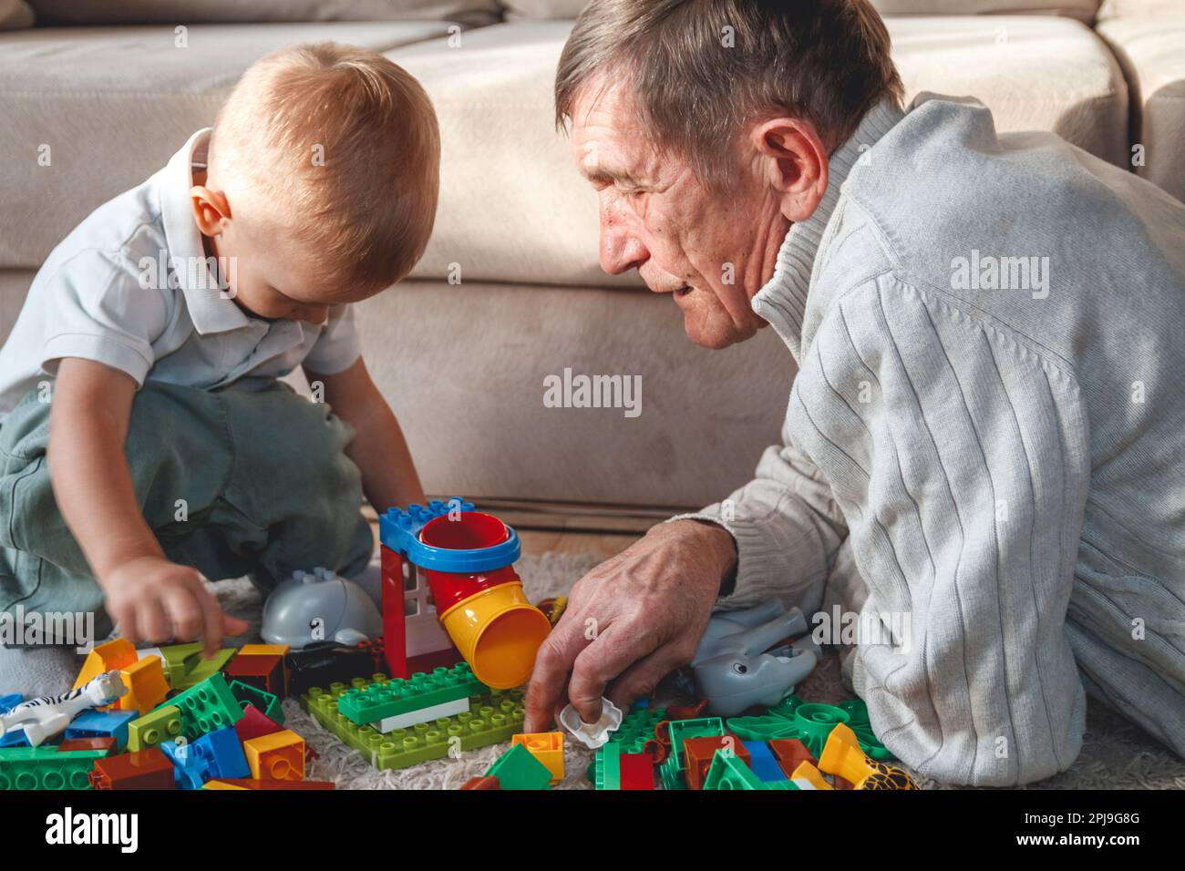 Boy grandfather blocks hi-res stock photography and images - Alamy