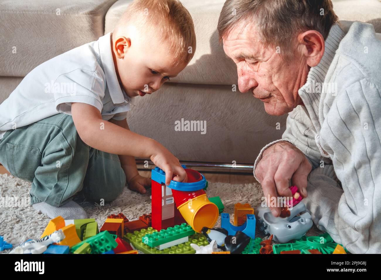 Boy grandfather blocks hi-res stock photography and images - Alamy