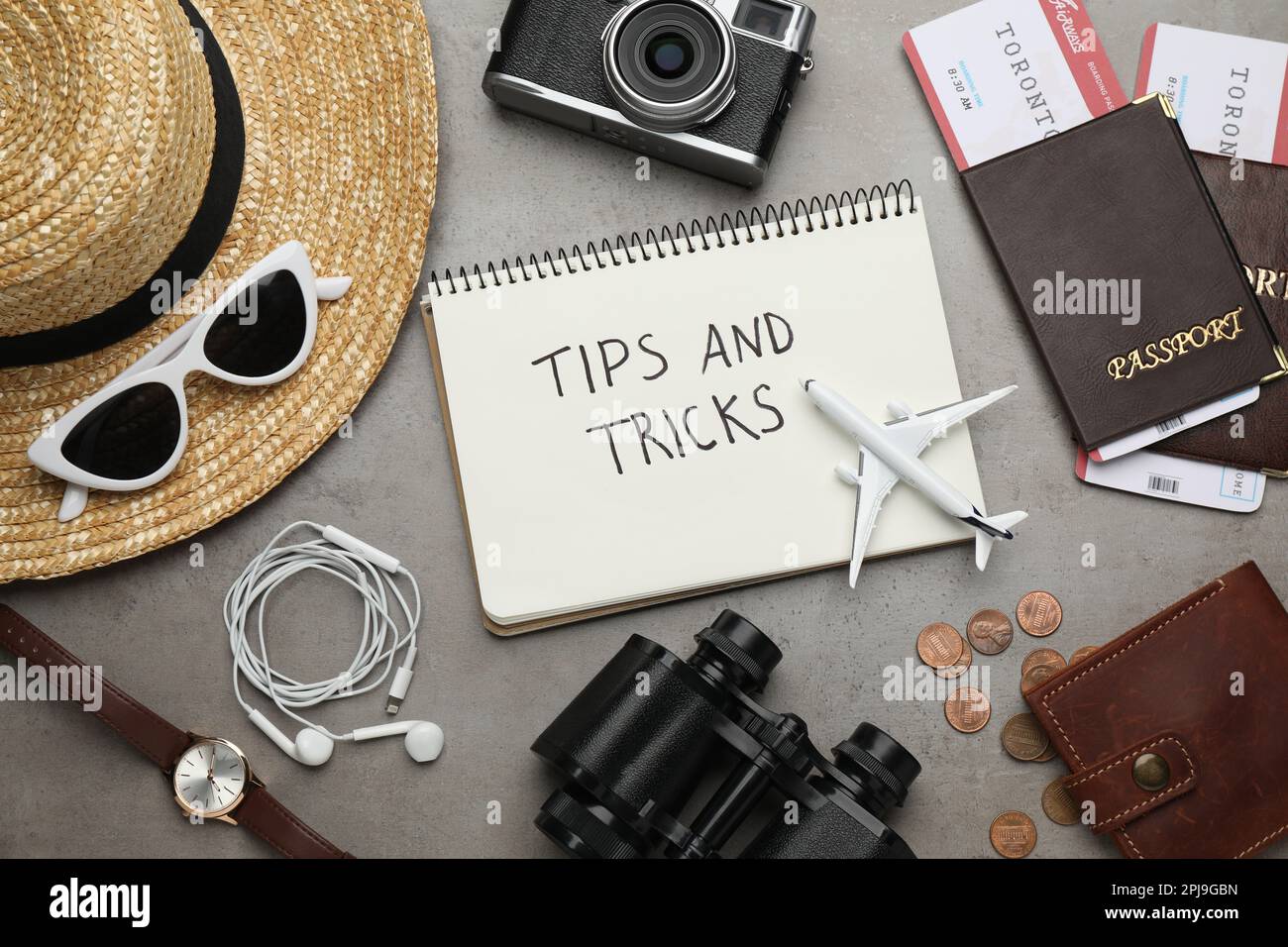 Flat lay composition with notebook on grey table. Tips and Tricks Stock ...