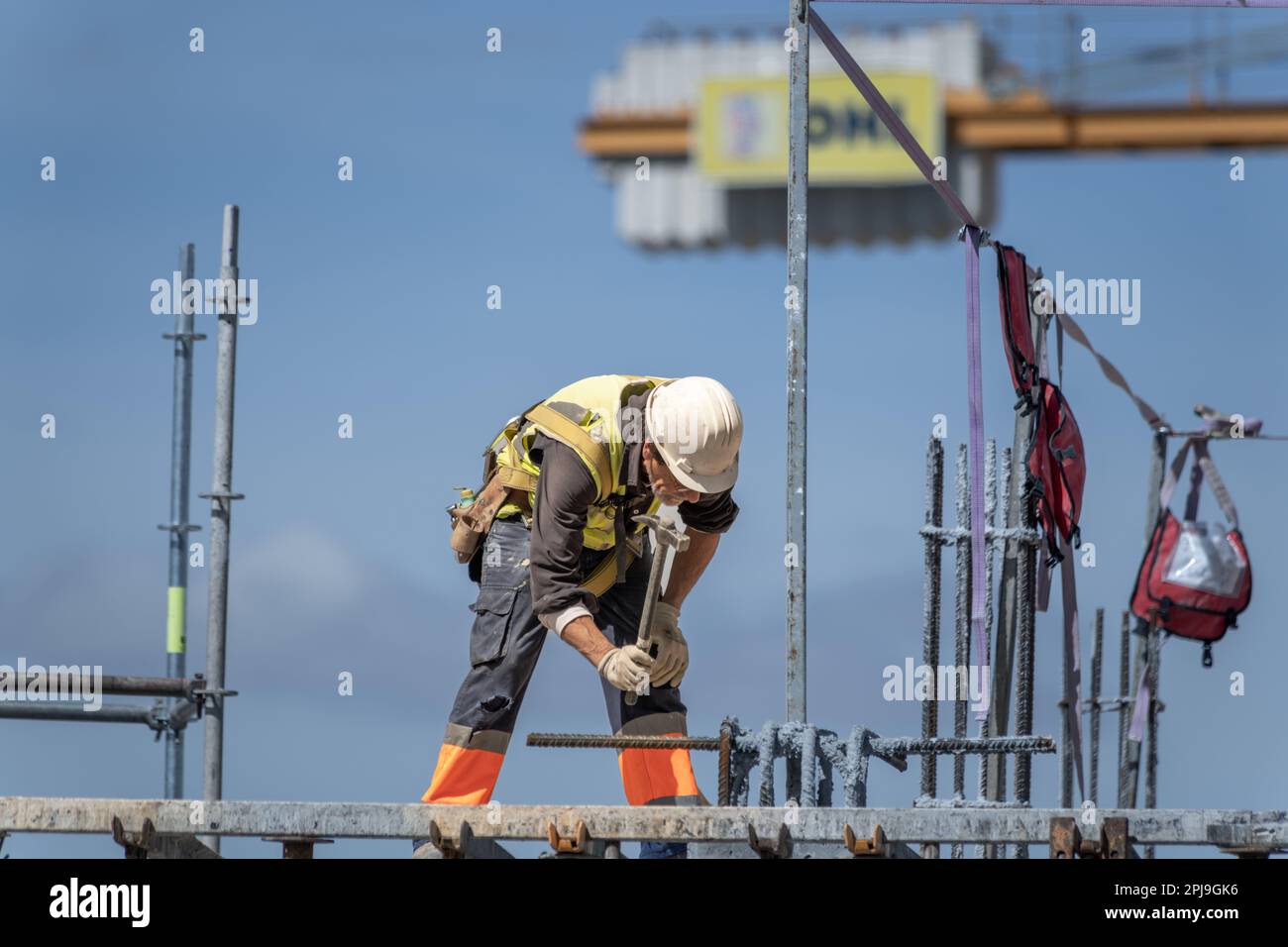 Labourer working on new modern high rise building hi-res stock ...