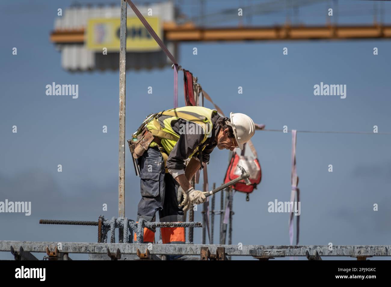Labourer working on new modern high-rise building, Spain Stock Photo ...