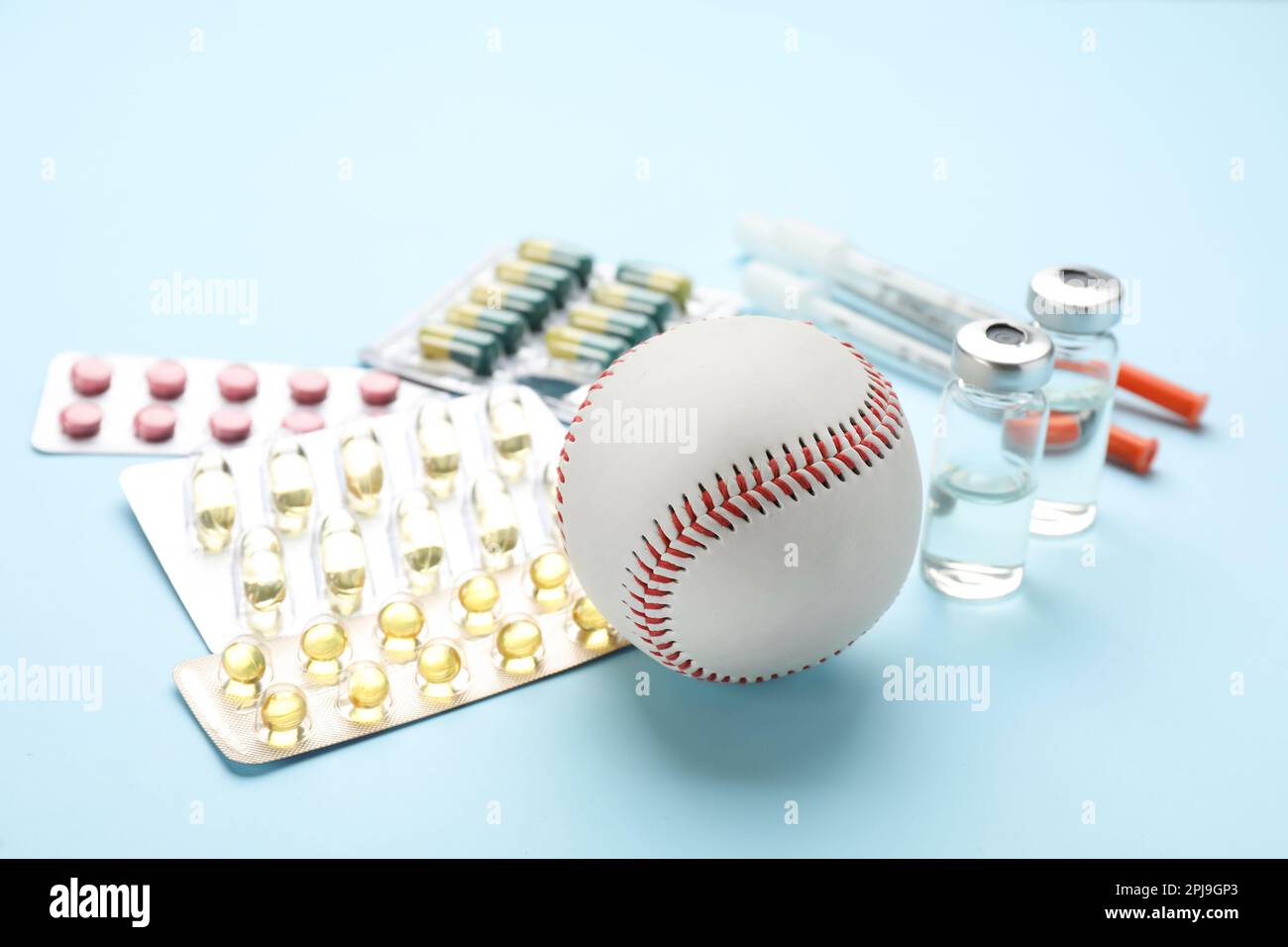 Baseball ball and drugs on light blue background. Doping concept Stock ...