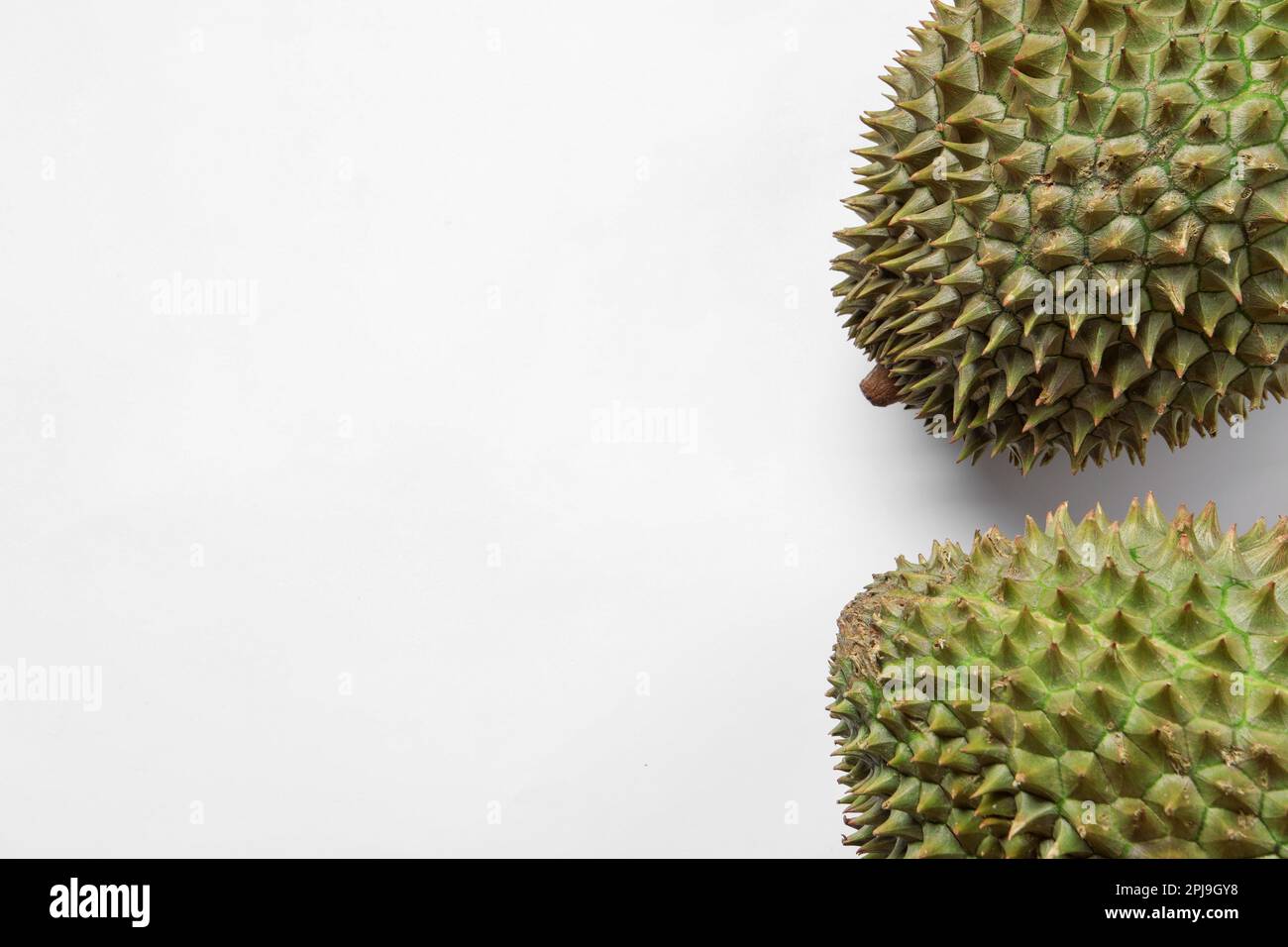 Fresh ripe durians on white background, flat lay. Space for text Stock ...