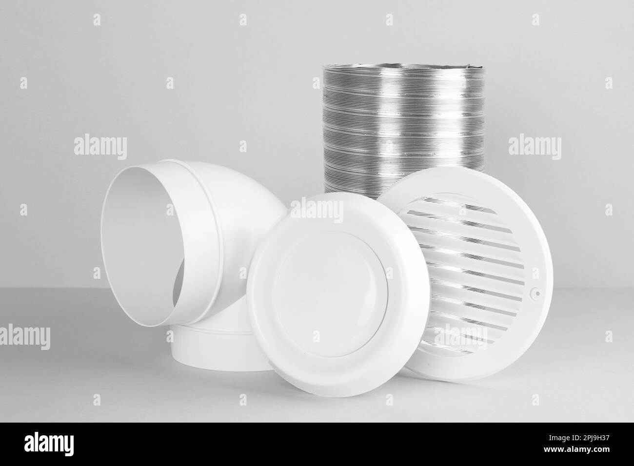 Parts of home ventilation system on light grey background Stock Photo ...